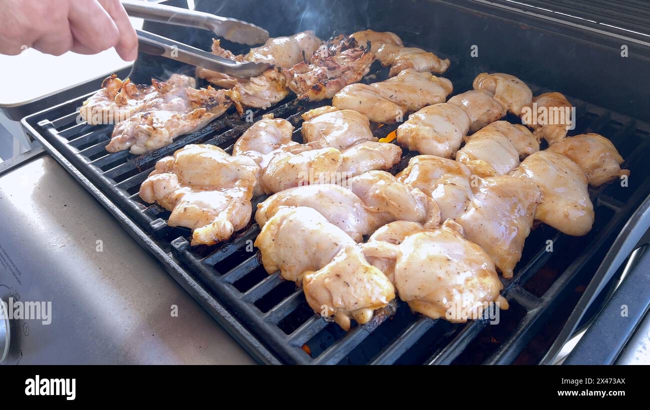 Grilling Marinated Chicken on an Outdoor BBQ Grill Stock Photo - Alamy