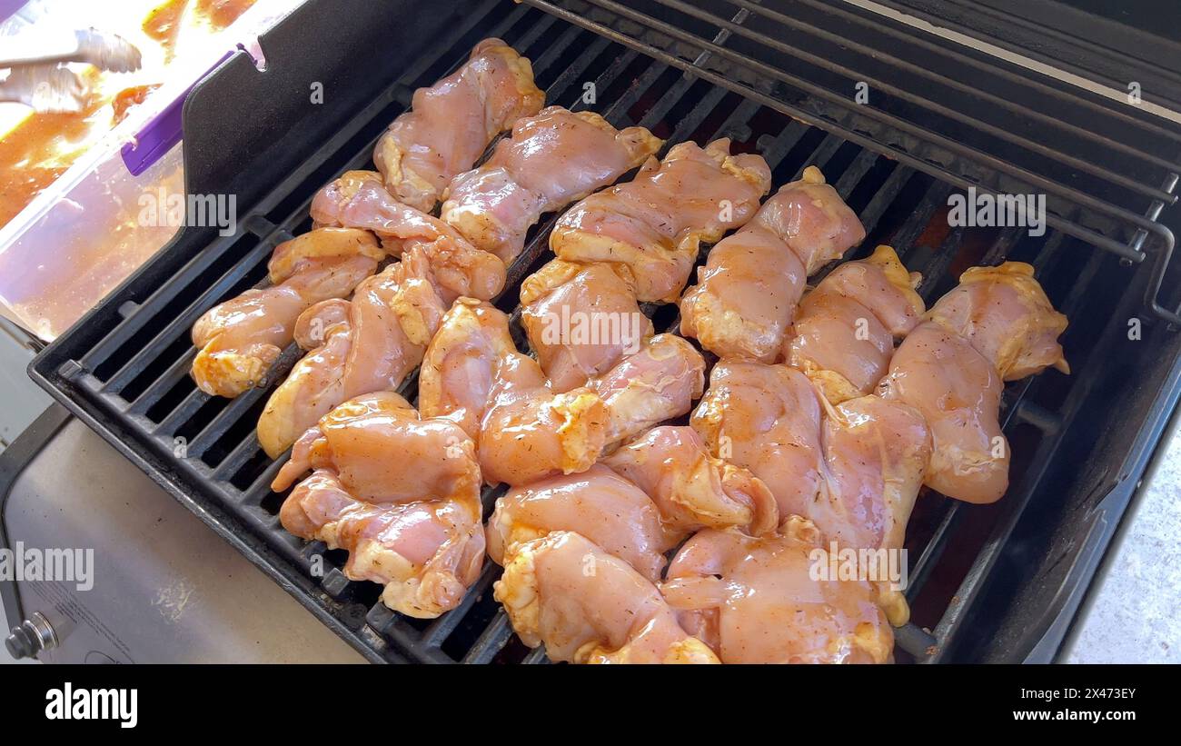 Grilling Marinated Chicken on an Outdoor BBQ Grill Stock Photo - Alamy
