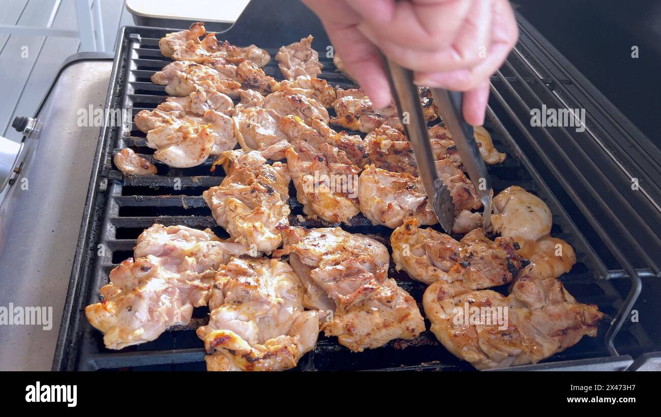 Grilling Marinated Chicken on an Outdoor BBQ Grill Stock Photo - Alamy