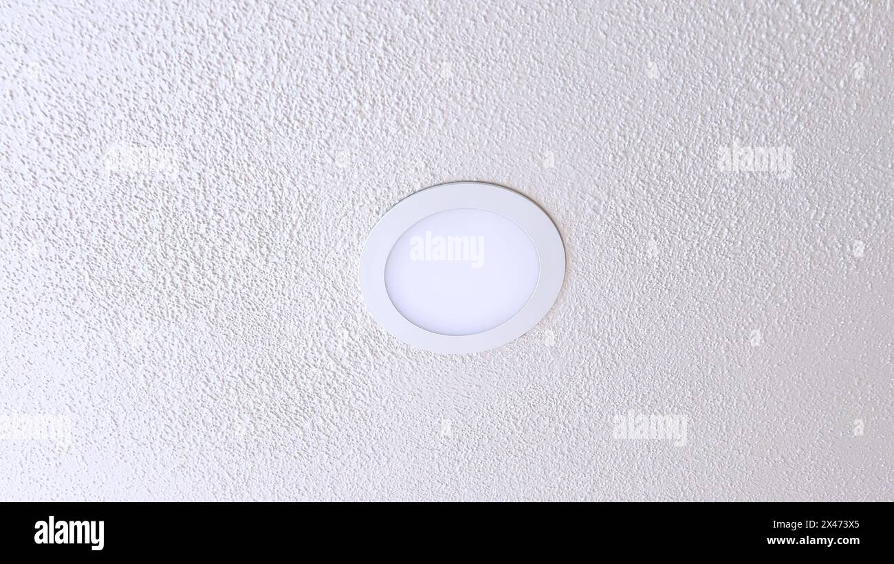 Minimalist Ceiling Light Fixture on Textured White Ceiling Stock Photo ...