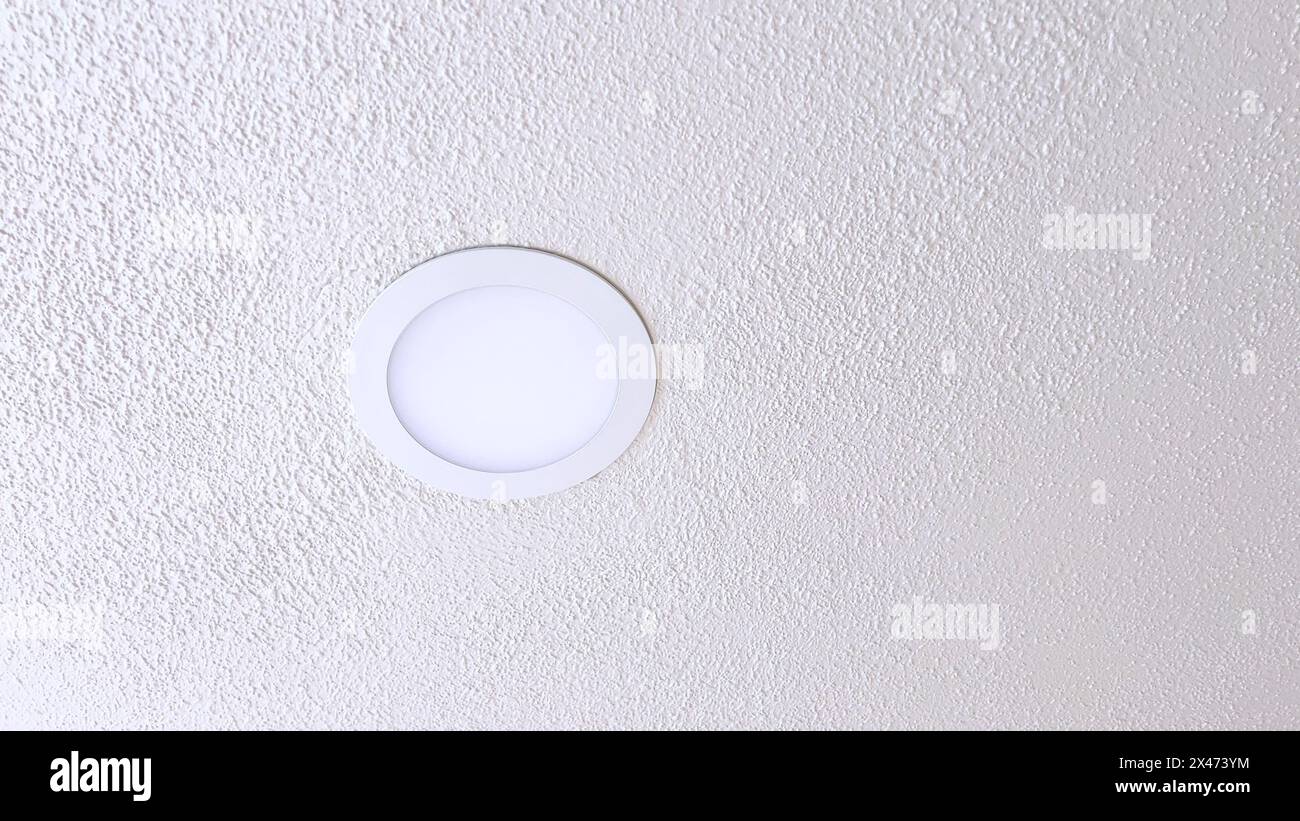 Minimalist Ceiling Light Fixture on Textured White Ceiling Stock Photo ...