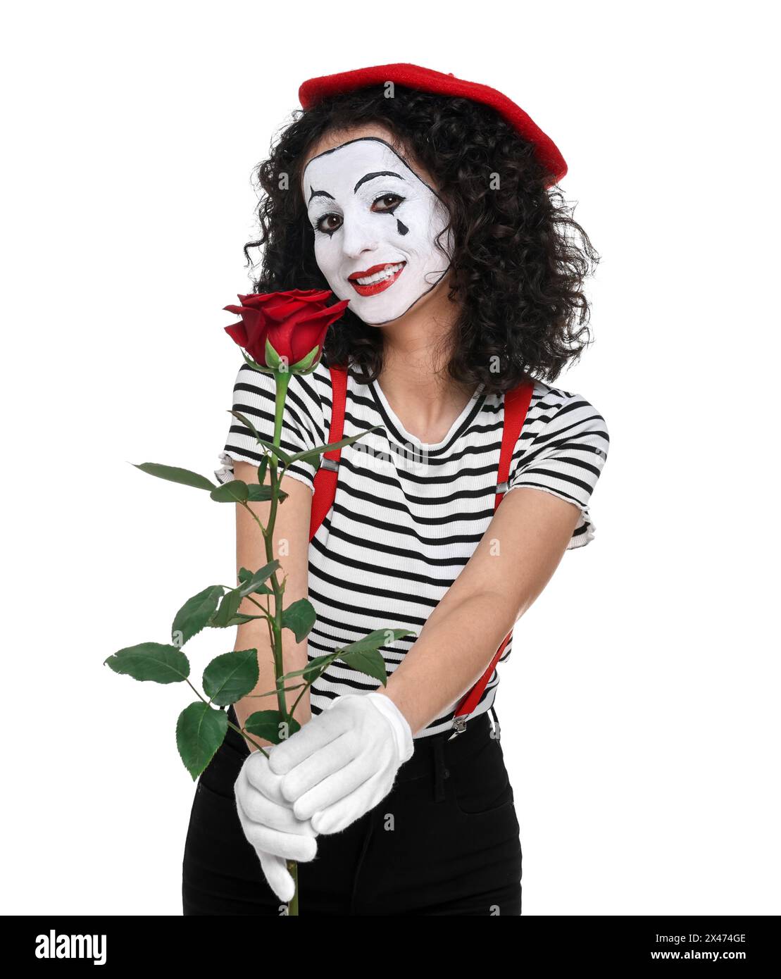 Funny mime with red rose posing on white background Stock Photo - Alamy