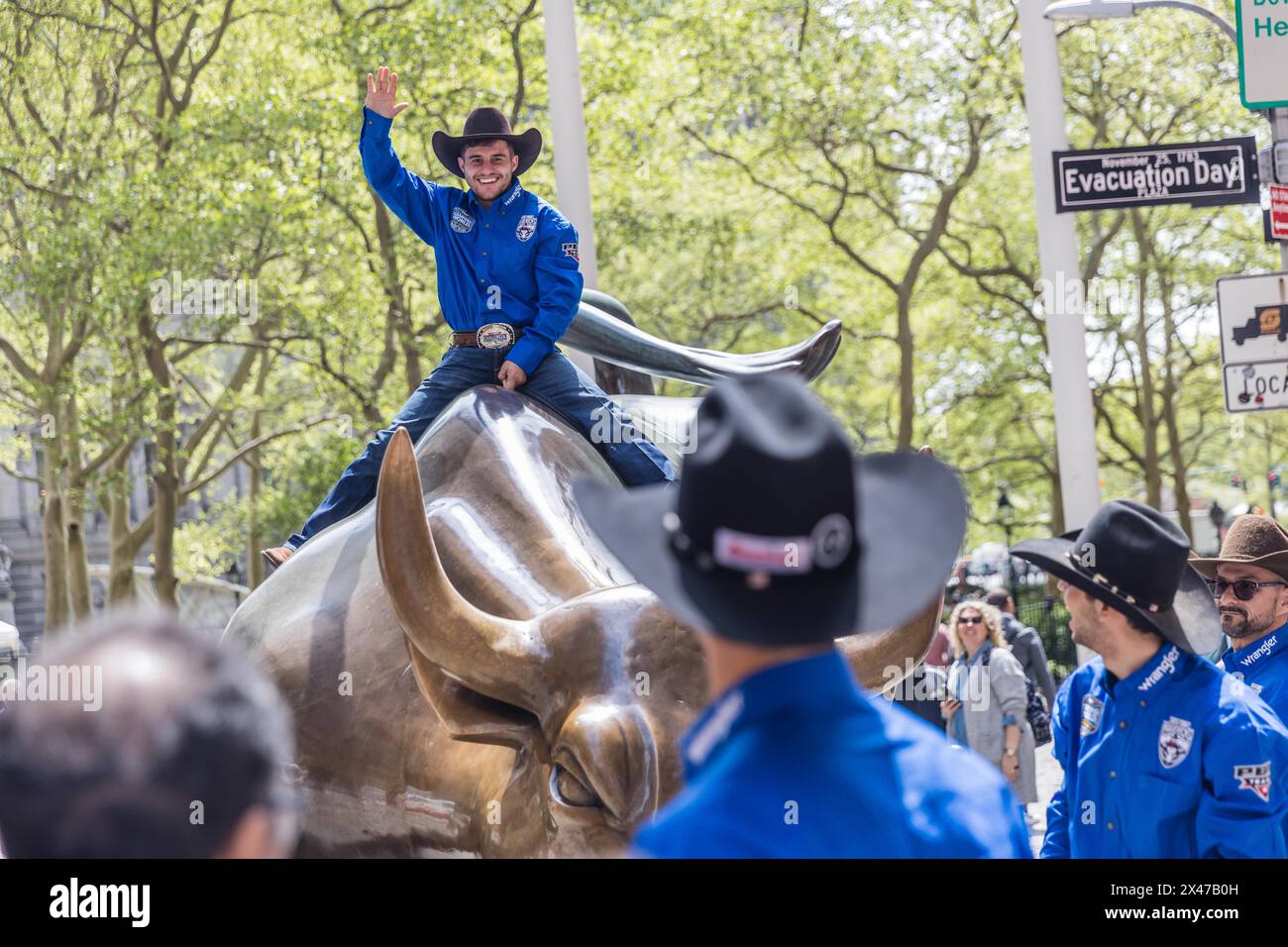 April 30, 2024, New York, Ny, United State: Tourist movement at the Wall Street bull in New York ...
