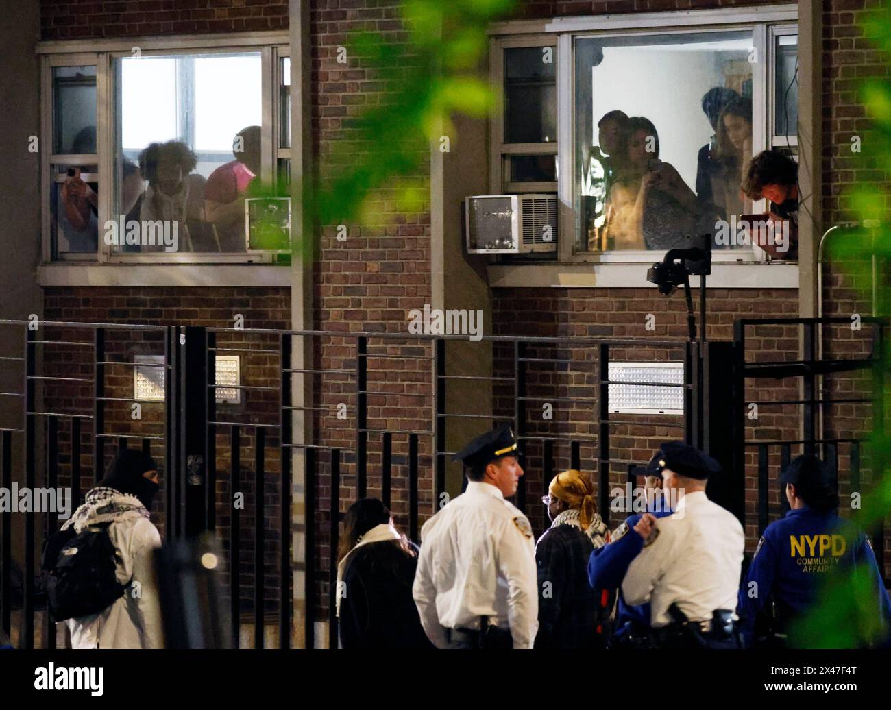 New York, United States. 30th Apr, 2024. Students and residents watch ...