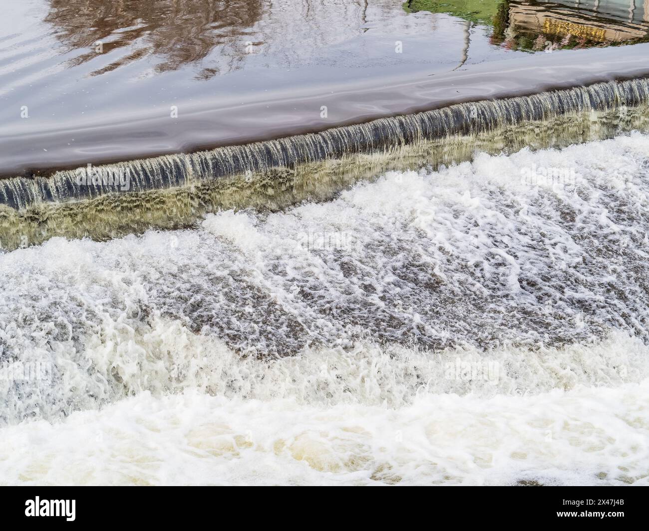 A small flat cascade in a calm river. Water background Stock Photo - Alamy