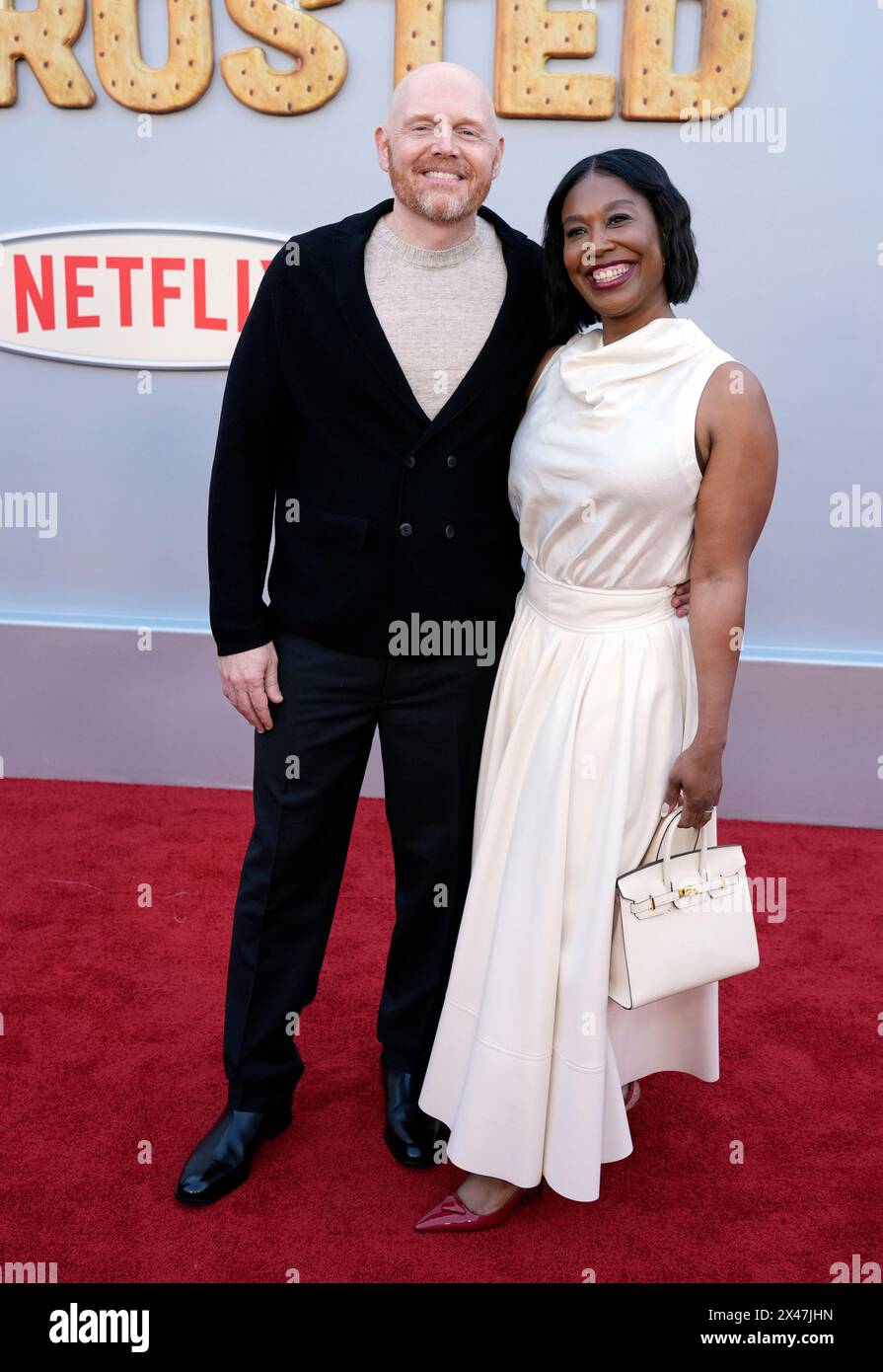 Bill Burr, left, a cast member in "Unfrosted," and his wife Nia Renee ...