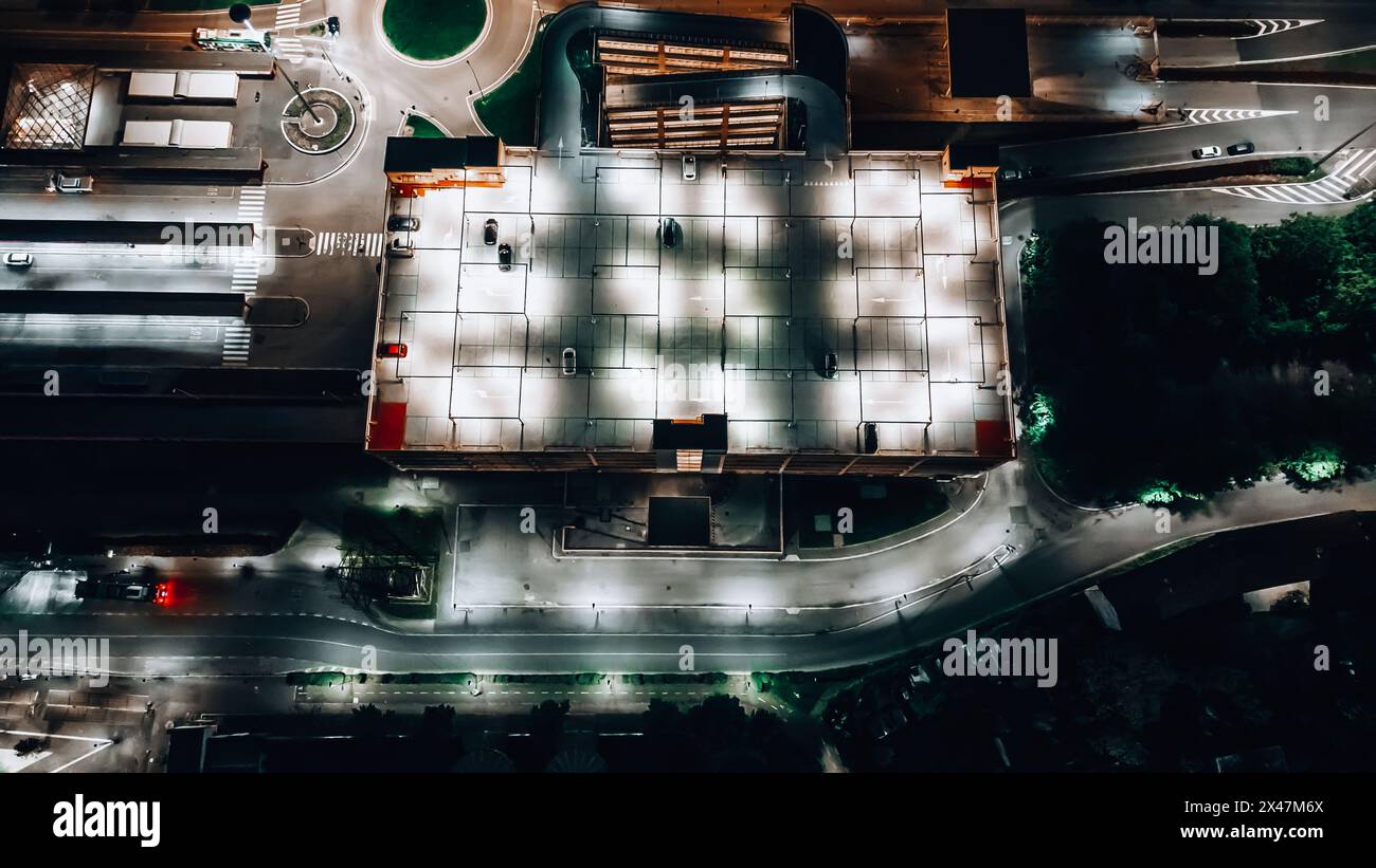 Parking lot with car at night aerial view Stock Photo - Alamy
