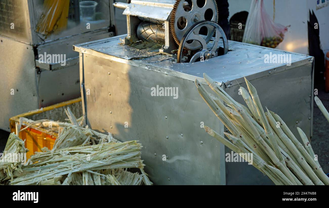 sugar cane press on a street market on phu quoc island Stock Photo - Alamy