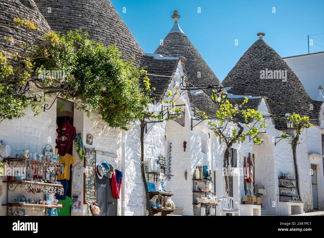 Beautiful stone of Trulli houses with white walls, narrow streets ...