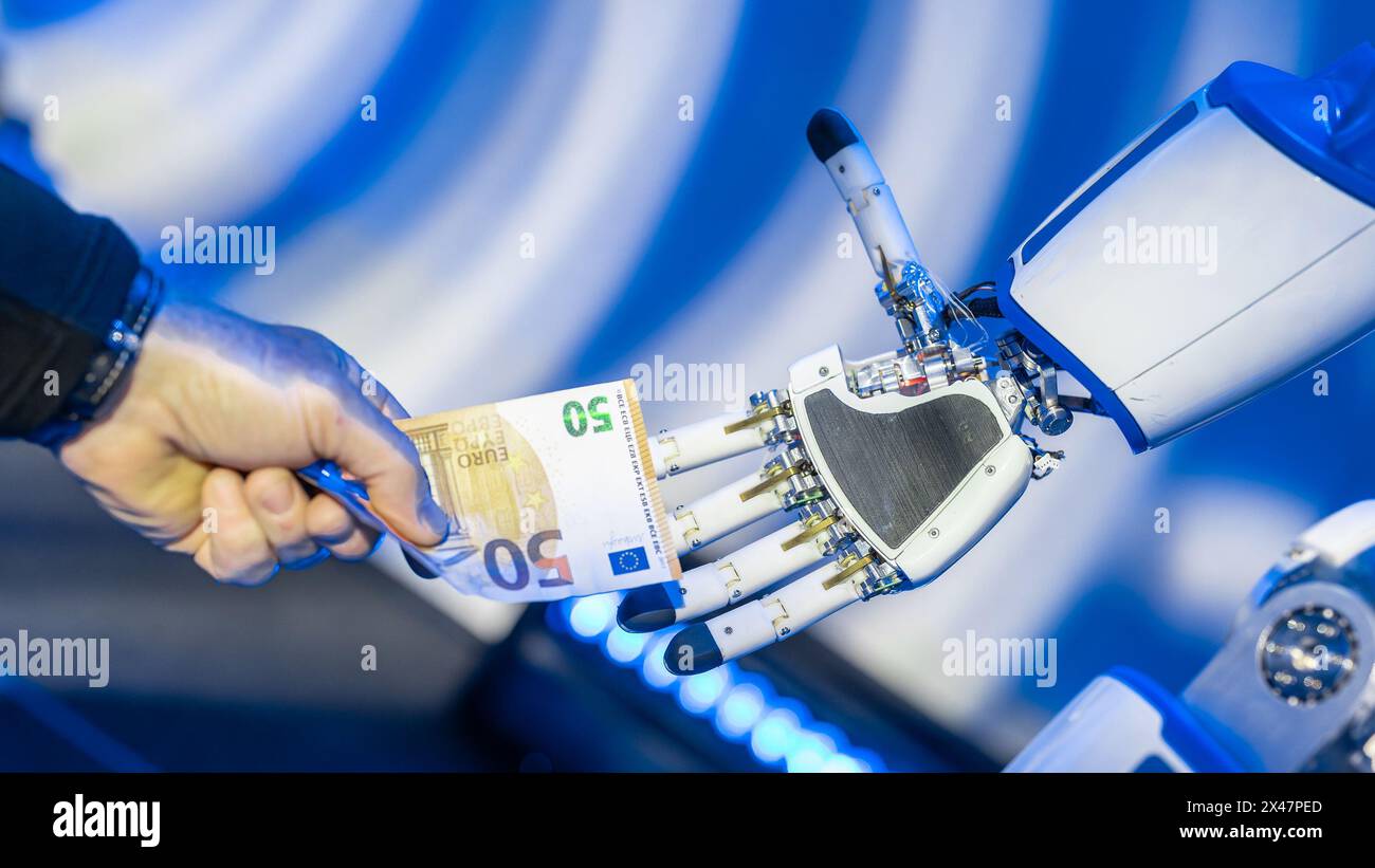 Hand of a person giving money 50eur to a robotic arm. Robot receiving ...