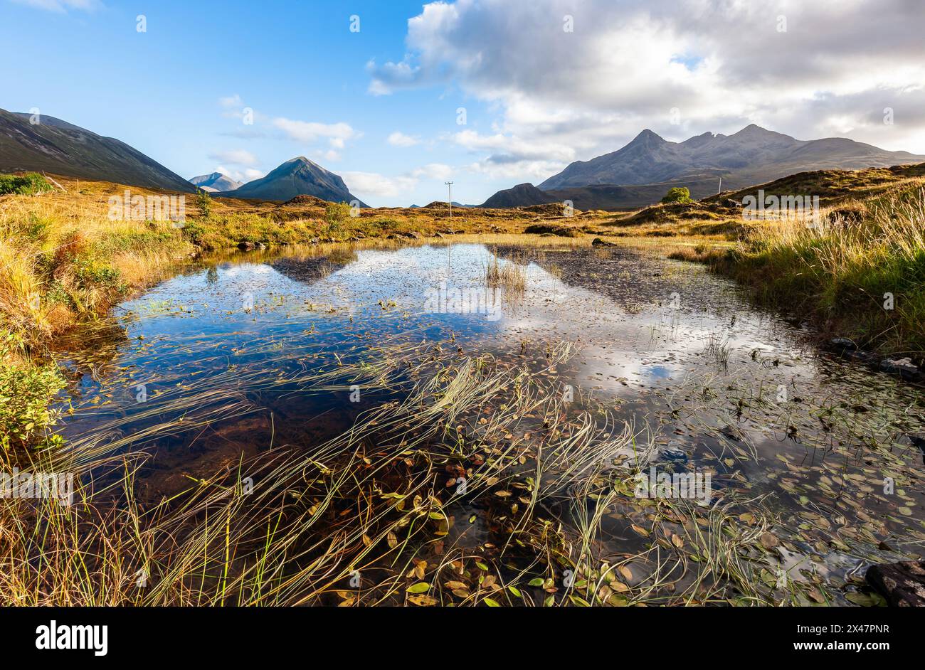 Mountain reflection in water with clouds in Scotland, Sligachan, Isle ...