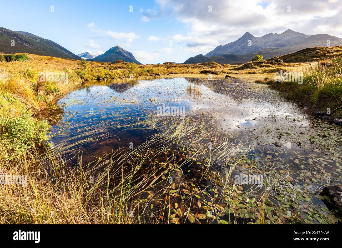 Mountain reflection in water with clouds in Scotland, Sligachan, Isle ...