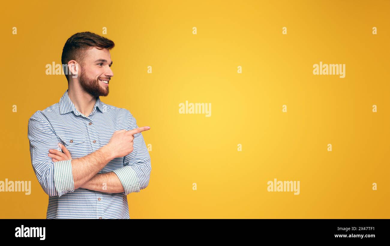Bearded Man Pointing at Object Stock Photo - Alamy