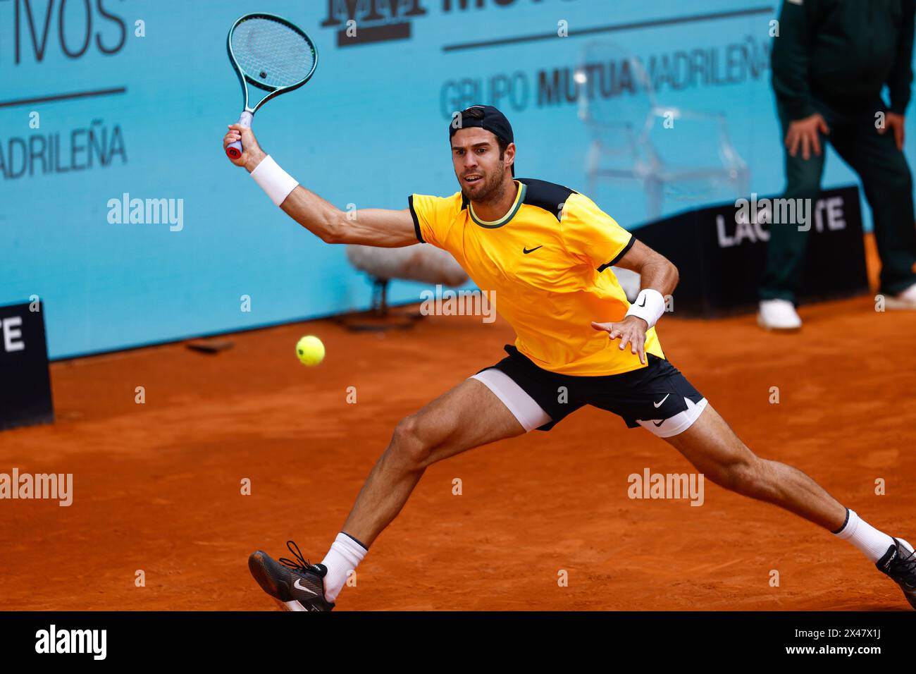 Karen Khachanov of Russia in action against Jannik Sinner of Italy during the Mutua Madrid Open ...
