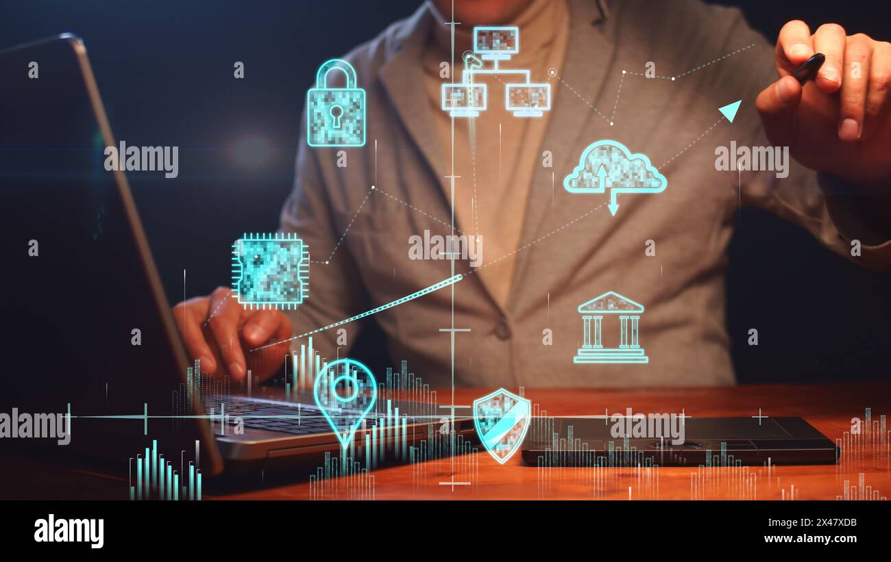 A businessman working on a laptop and graphics tablet models graphics ...