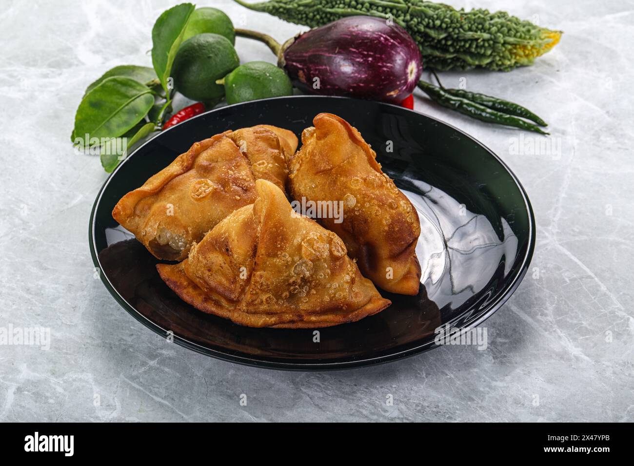 Indian cuisine - fries crispy stuffed samosa Stock Photo - Alamy