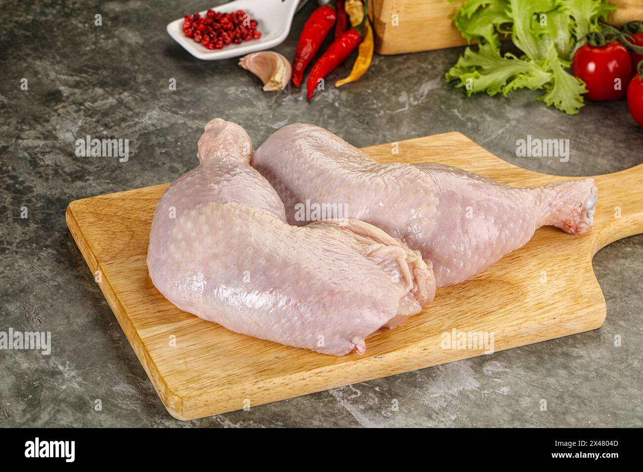 Raw chicken leg foe cooking over board Stock Photo - Alamy