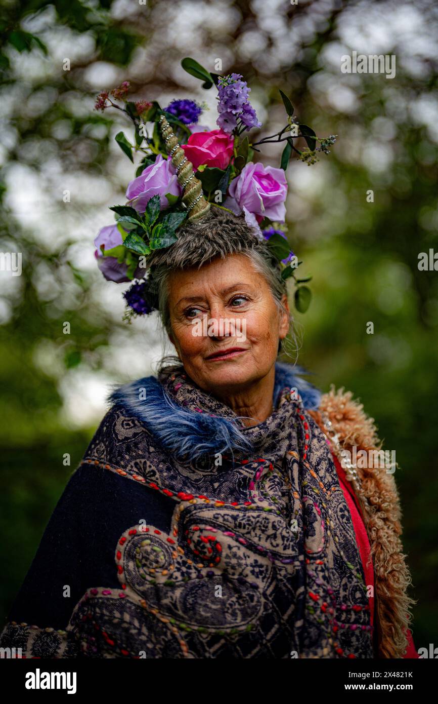 A woman in a floral headdress during the Beltane celebrations at ...