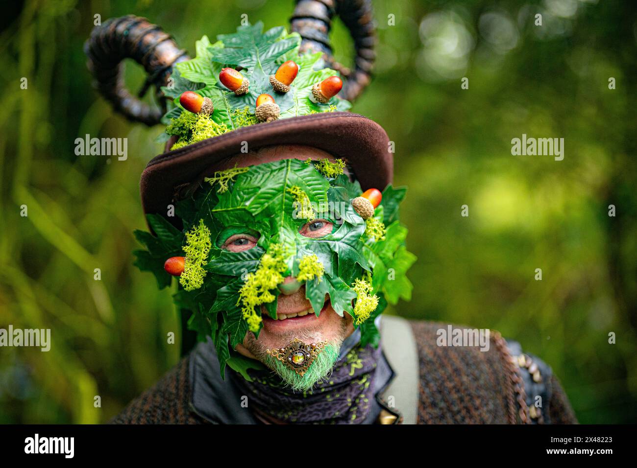 A green man takes part in Beltane celebrations at Glastonbury Chalice ...