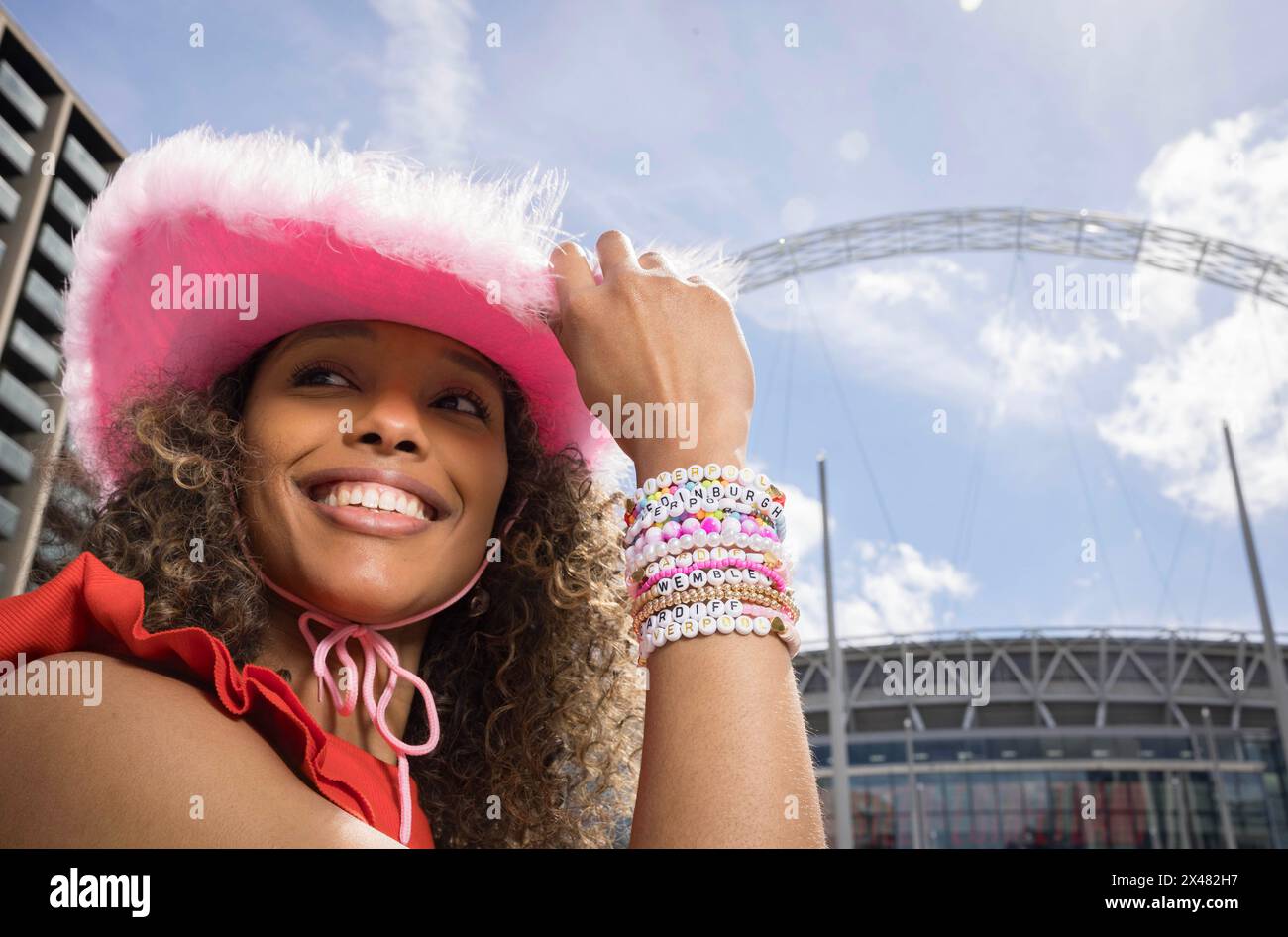 EDITORIAL USE ONLY Andreia displays her bracelets outside Wembley ...