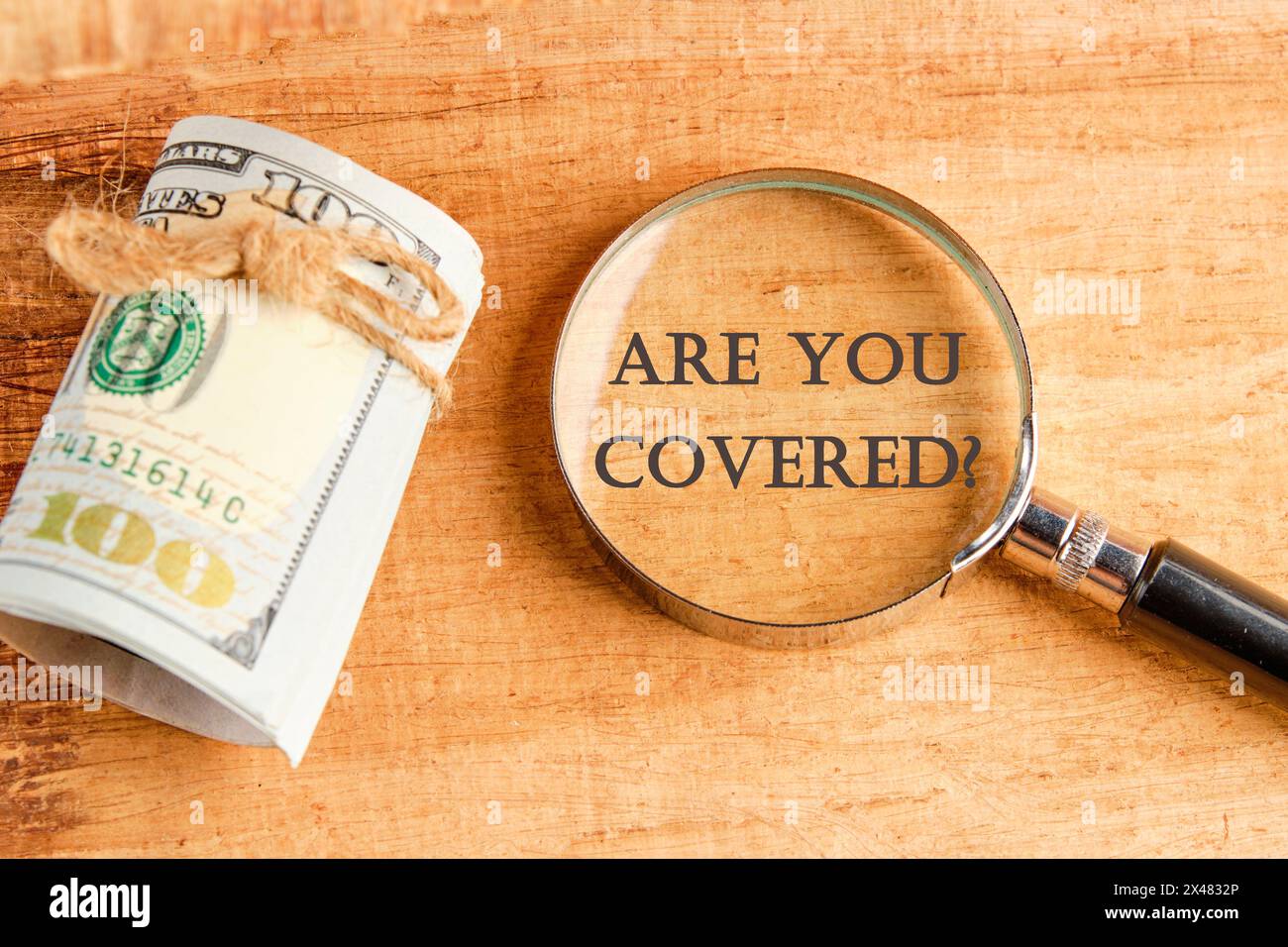 ARE YOU COVERED text written through a magnifying glass, they are ...