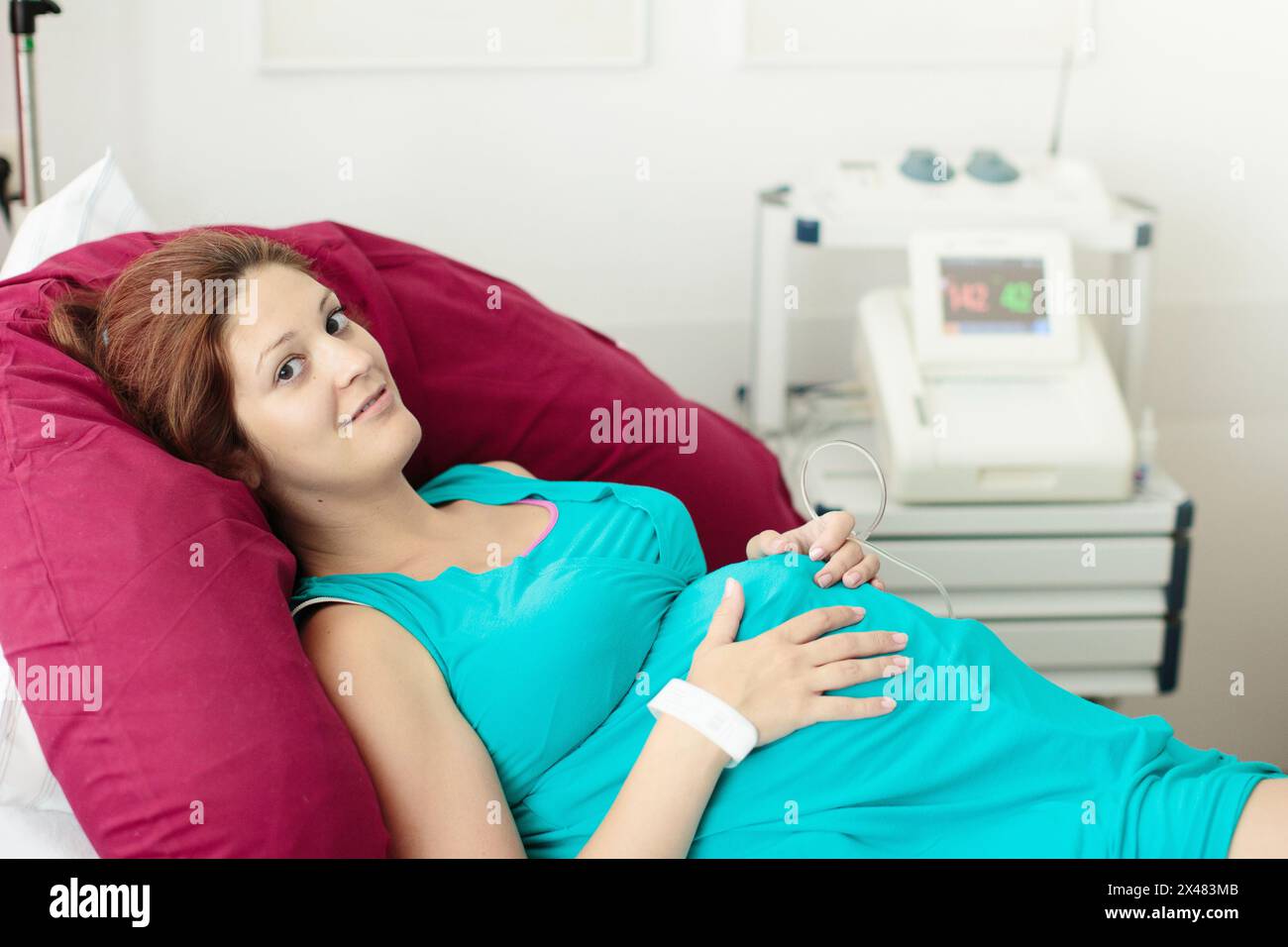 Mother giving birth to baby. Pregnant patient in a hospital at doctor ...