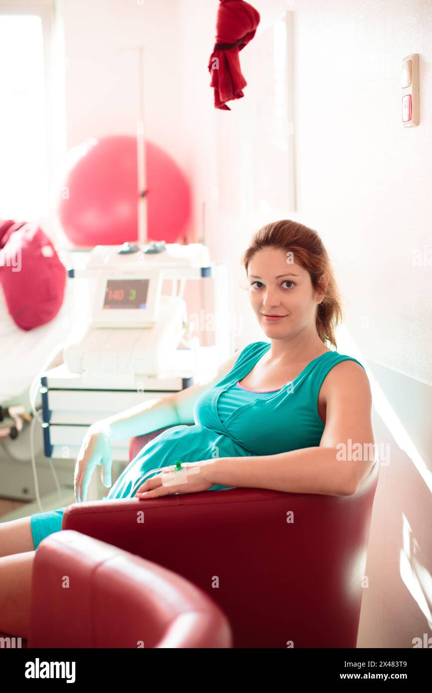 Mother giving birth to baby. Pregnant patient in a hospital at doctor ...