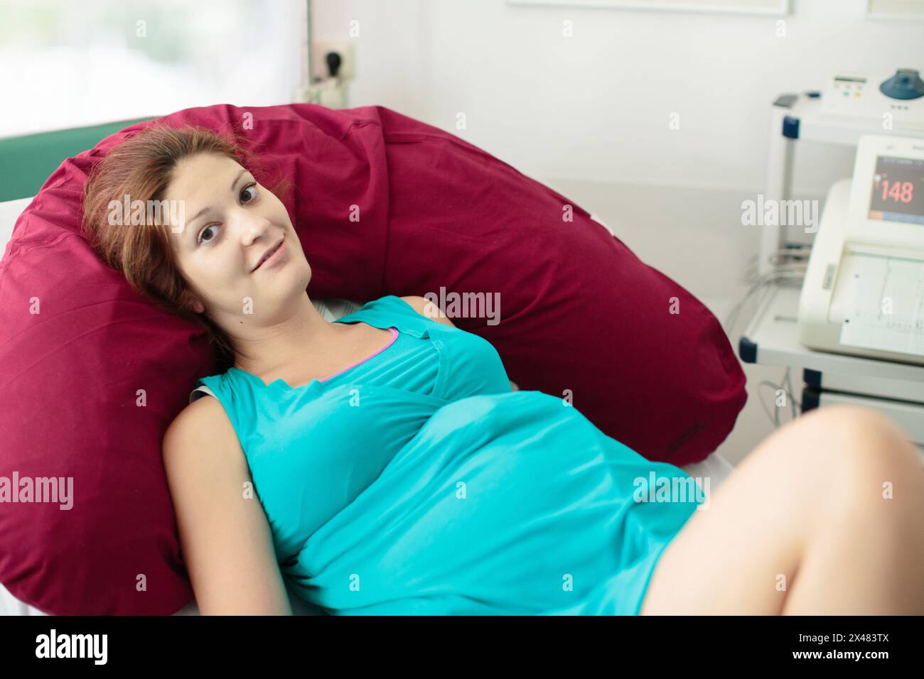 Mother giving birth to baby. Pregnant patient in a hospital at doctor ...