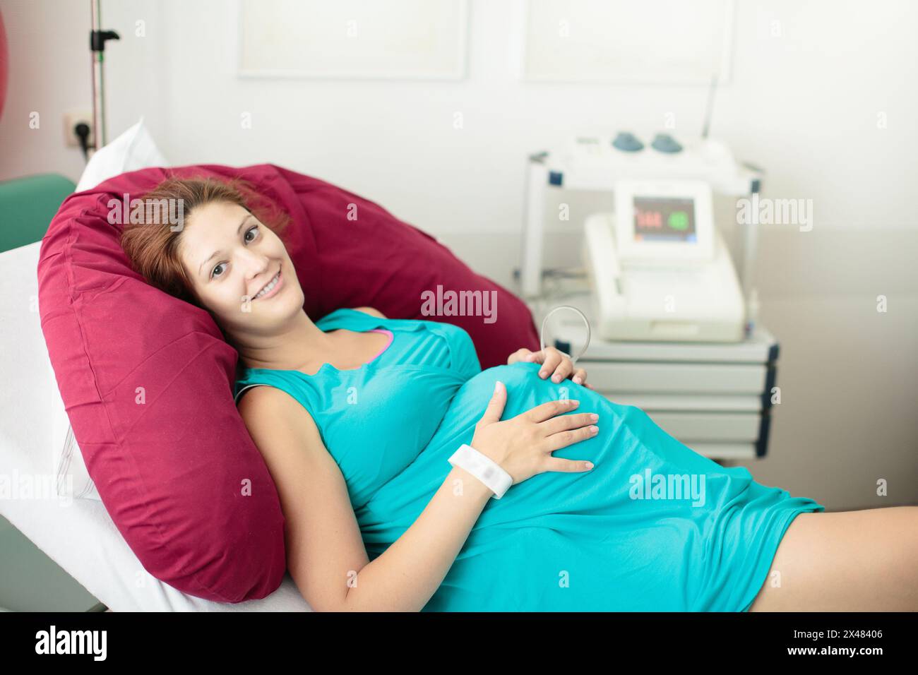 Mother giving birth to baby. Pregnant patient in a hospital at doctor ...