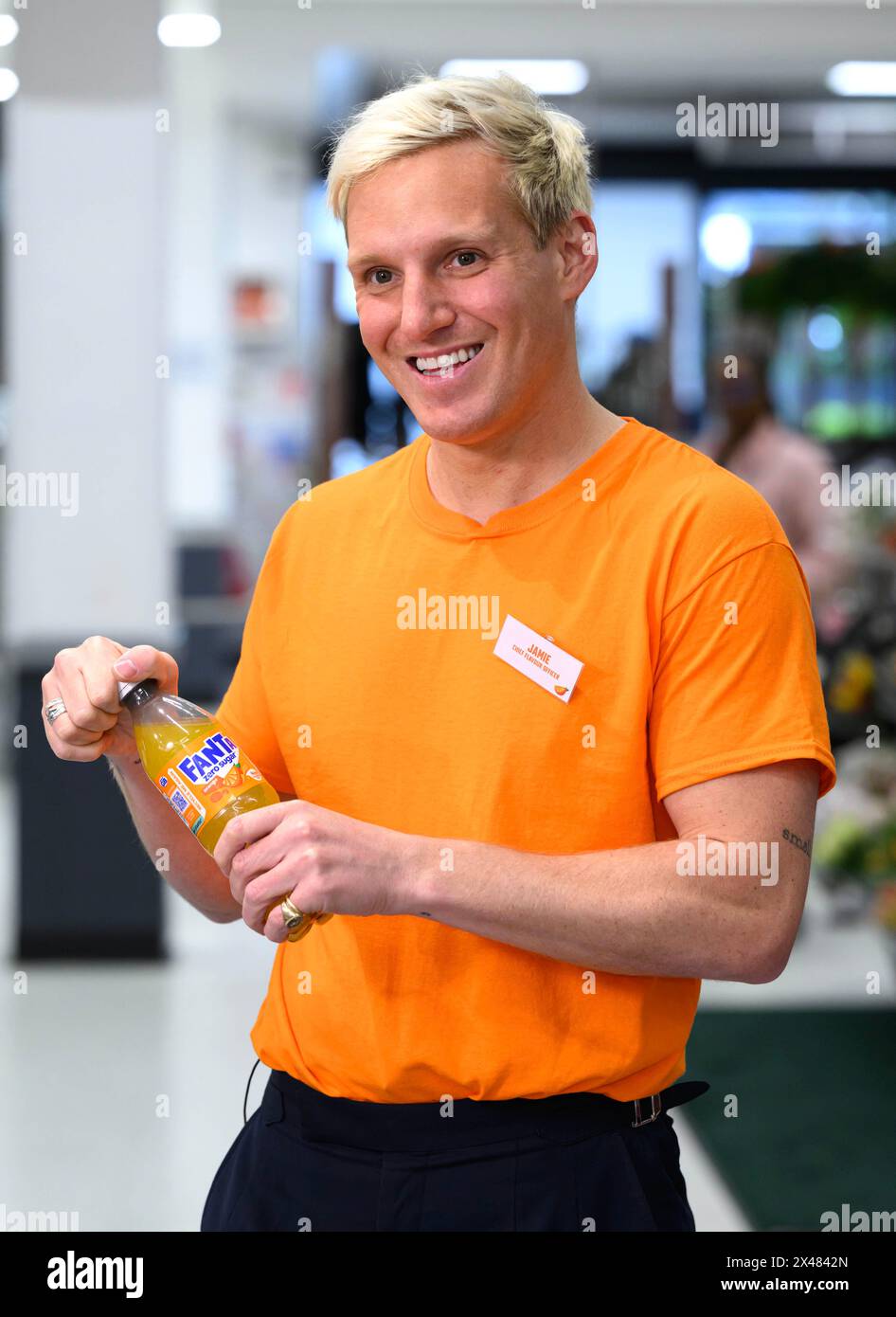 EDITORIAL USE ONLY Jamie Laing speaks with supermarket customers as he ...