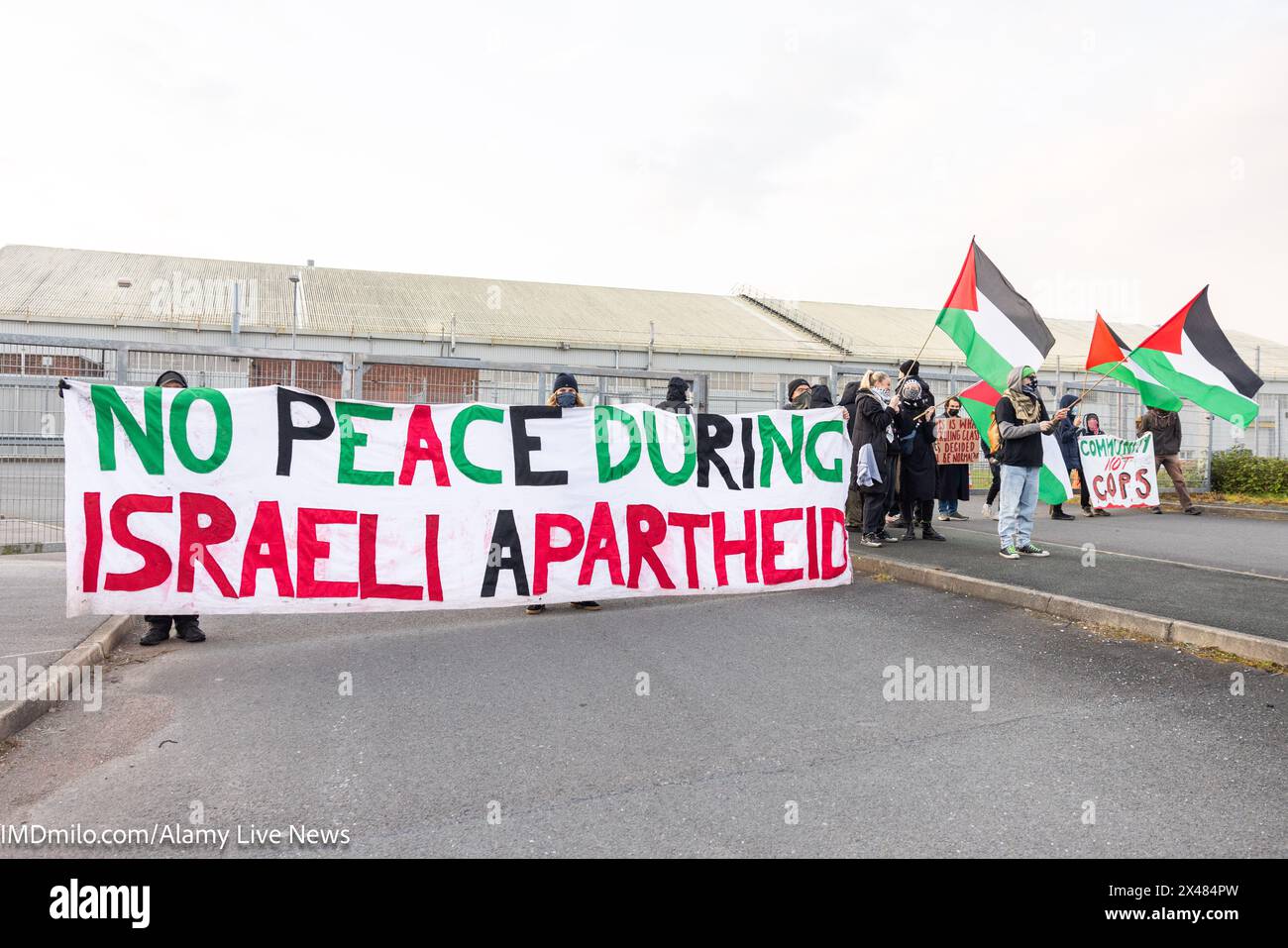 Preston, UK. 01 MAY, 2024. Activists hold various signs including "No ...