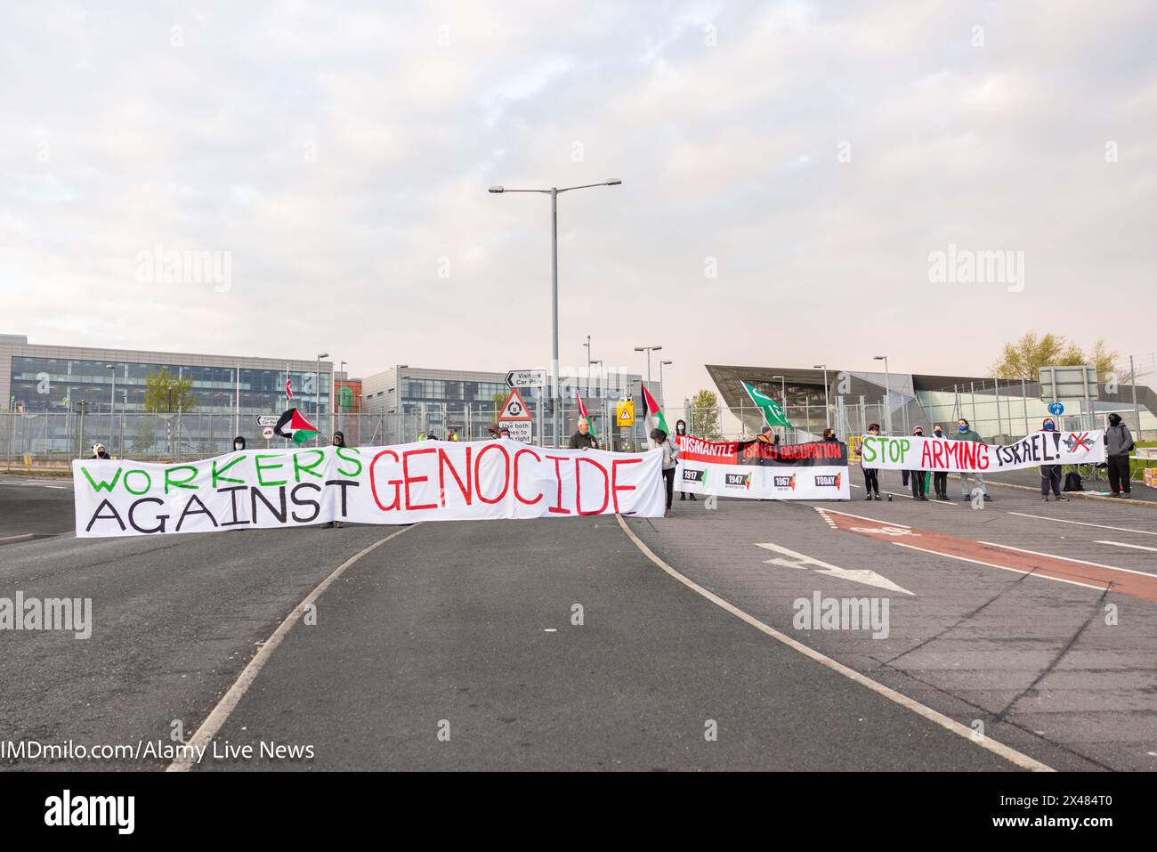Preston, UK. 01 MAY, 2024. Activists hold various signs including "No ...