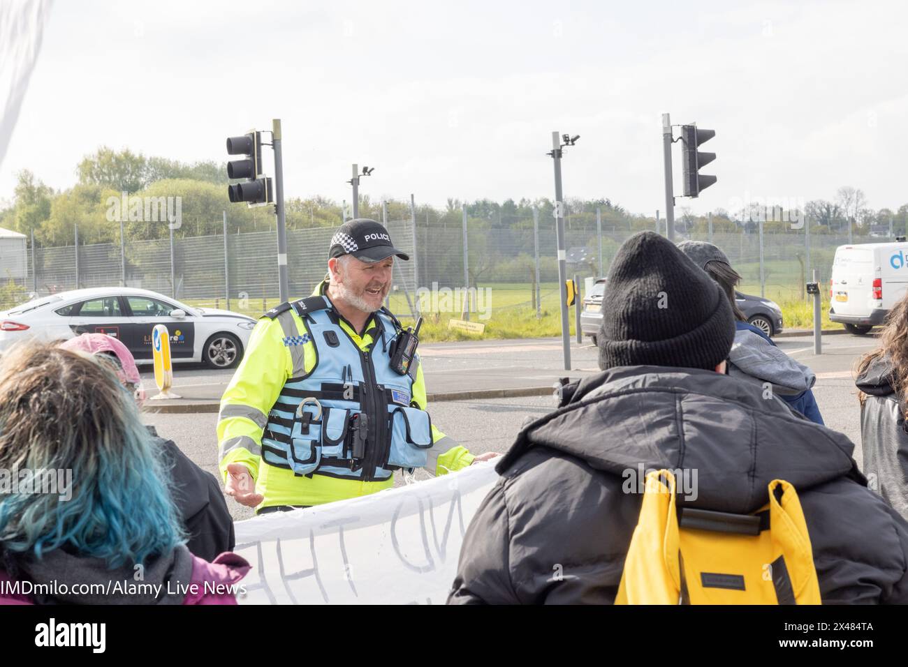Preston, UK. 01 MAY, 2024. Police Liason officer questions protestors ...
