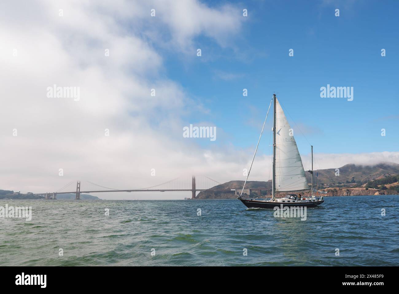 Sailing Yacht with Hoisted Sails Near Golden Gate Bridge, San Francisco ...