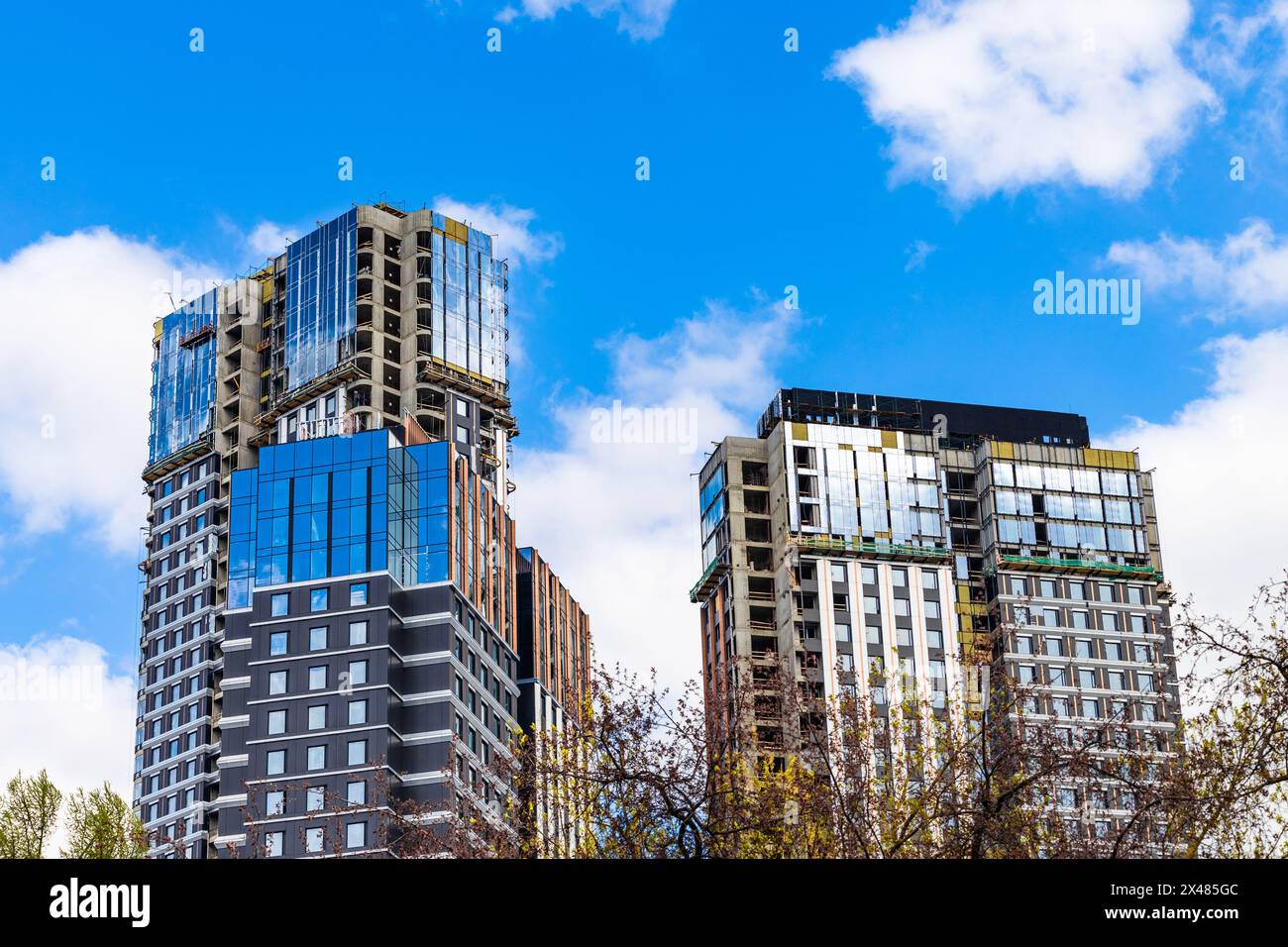 Moscow, Russia - April 22, 2024: finishing the facade of an apartment ...