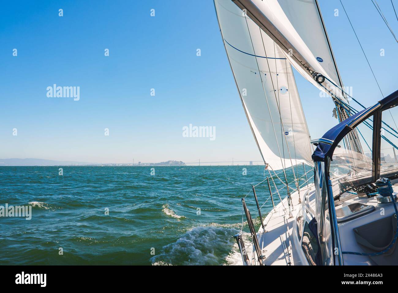 Sailing yacht with billowing white sails near San Francisco Stock Photo ...