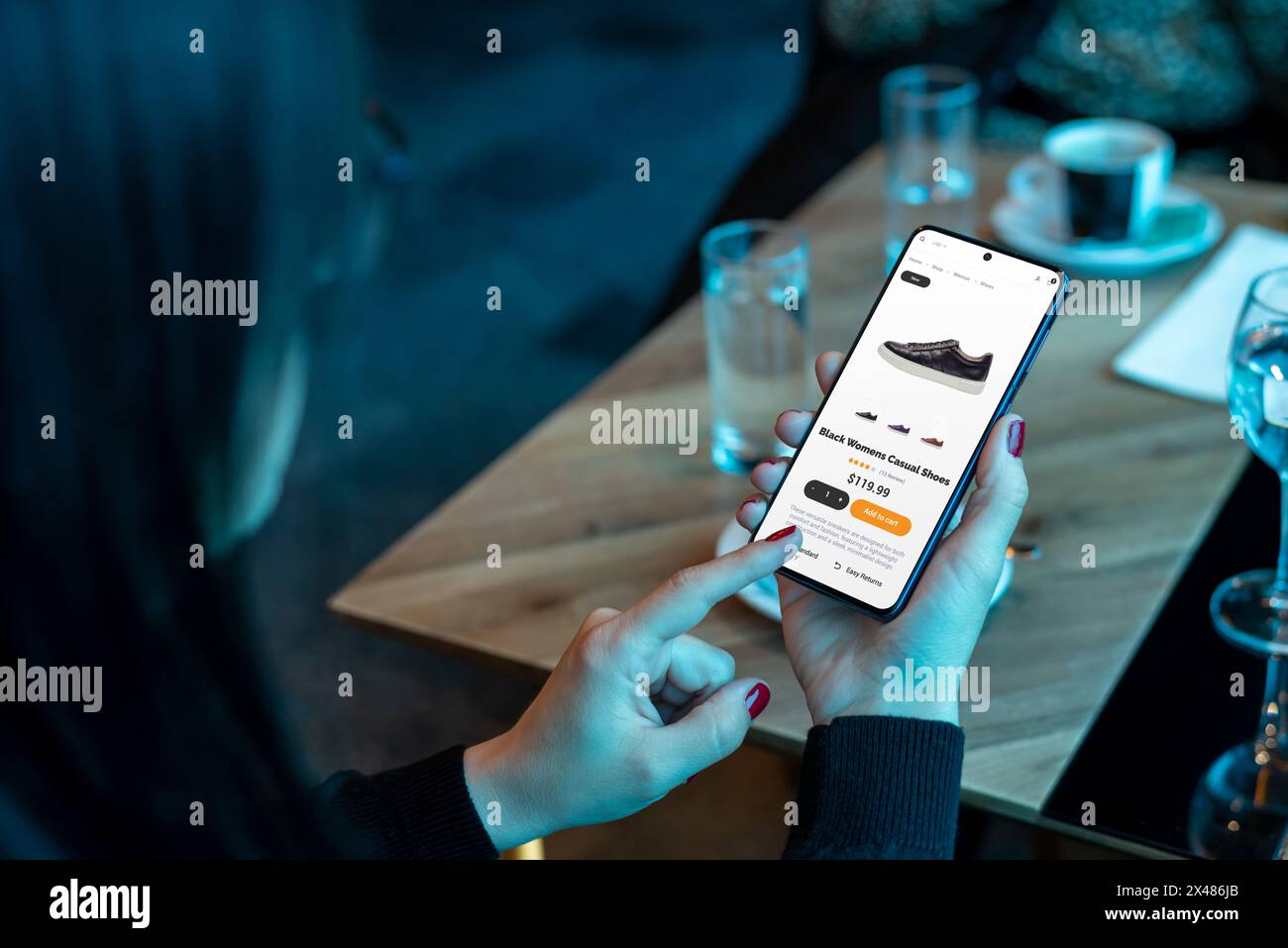Woman uses mobile phone for buying shoes. Modern ecommerce app with ...