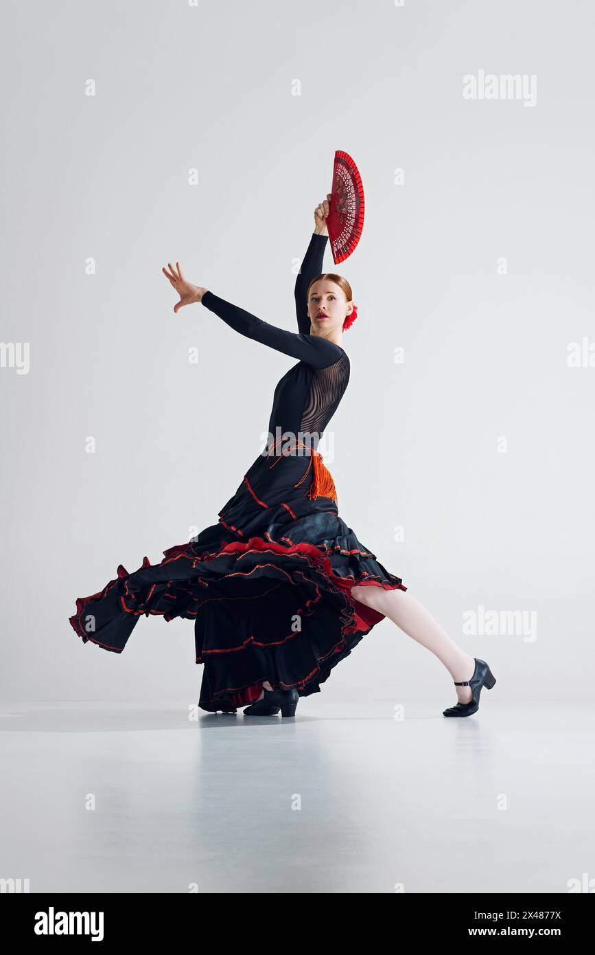 Elegance and emotion. Beautiful artistic woman, performing flamenco ...