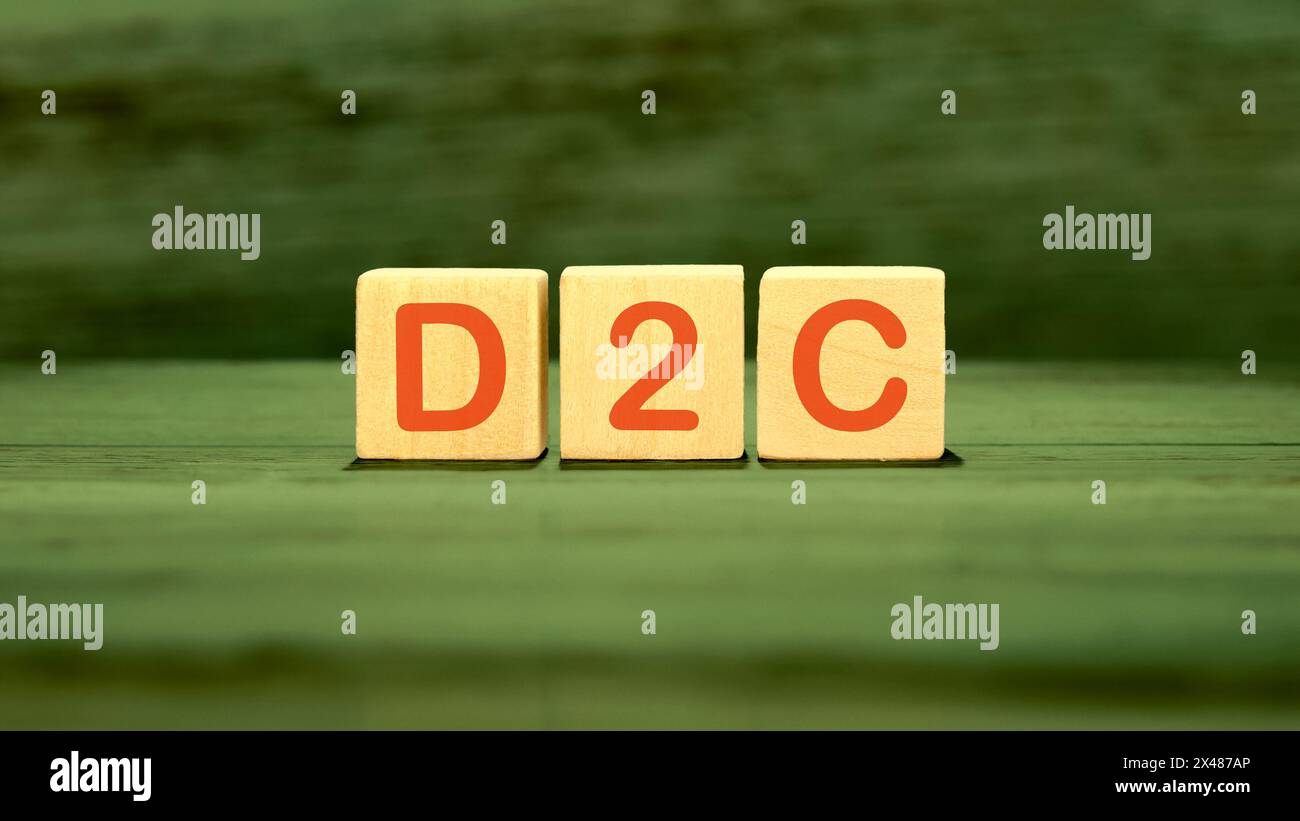 Concept of D2C (Direct to customer), word D2C on wooden cubes on green ...