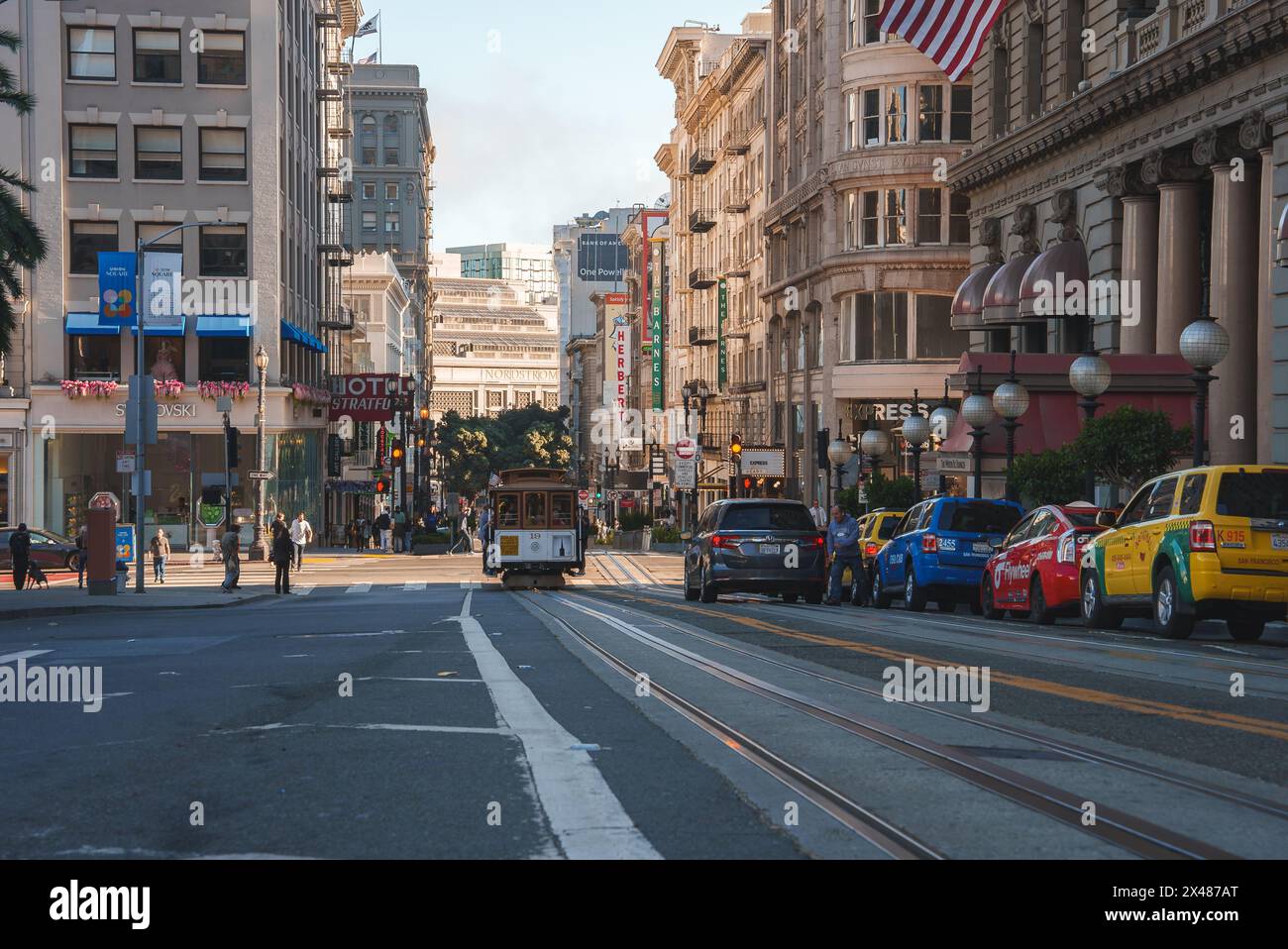 Bustling San Francisco street scene with classic cable car Stock Photo ...