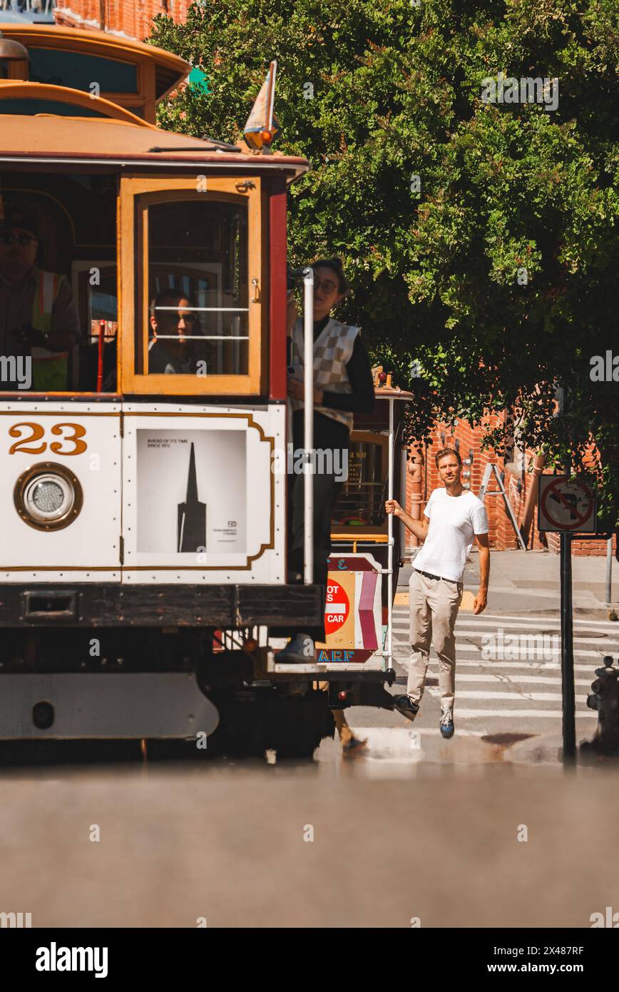 San Francisco cable car operator 23 on busy city street Stock Photo - Alamy