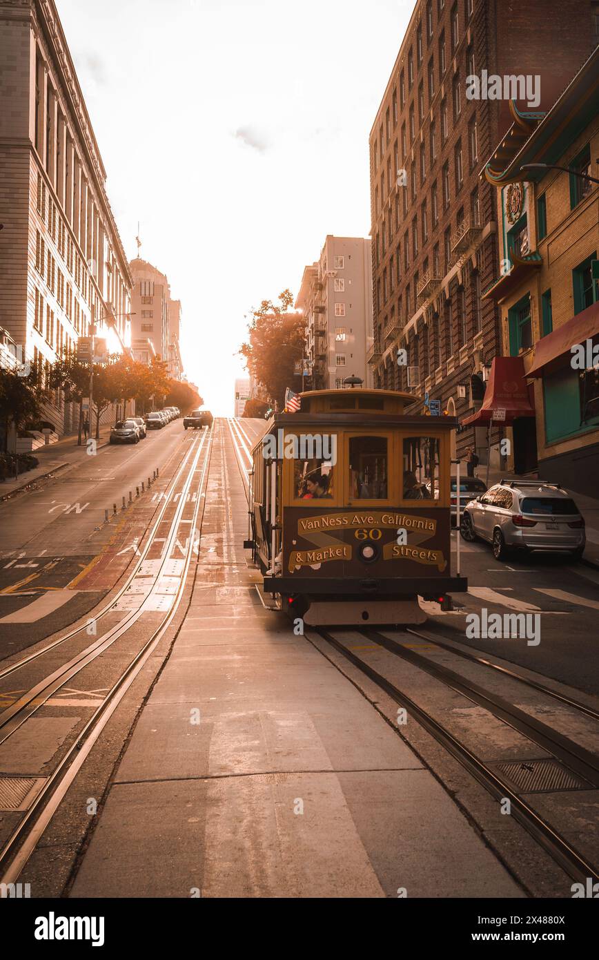 Iconic San Francisco cable car on city street at sunrise Stock Photo ...