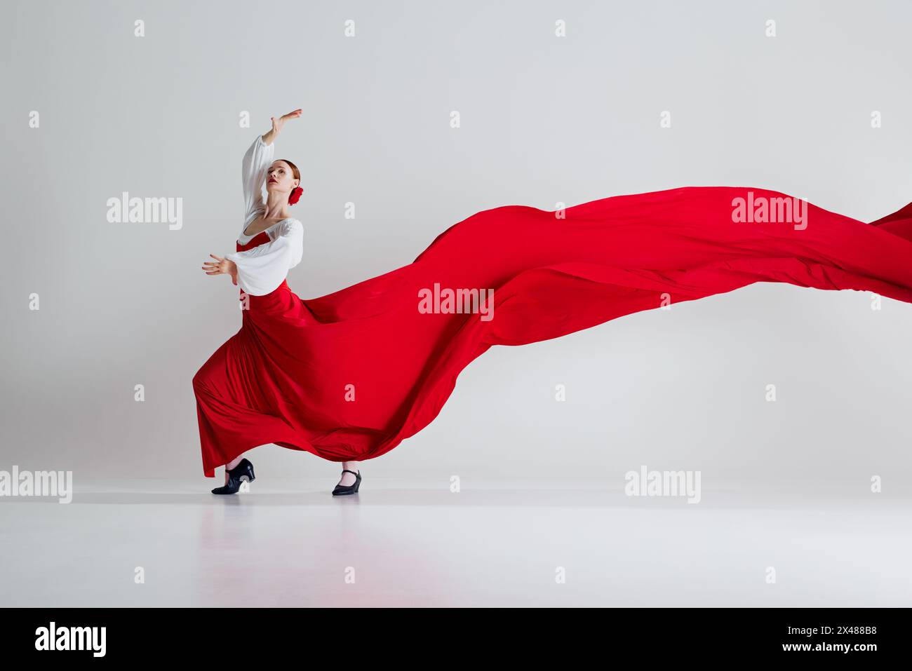 Stunning moment captures t essence of flamenco. Female dancer in red ...