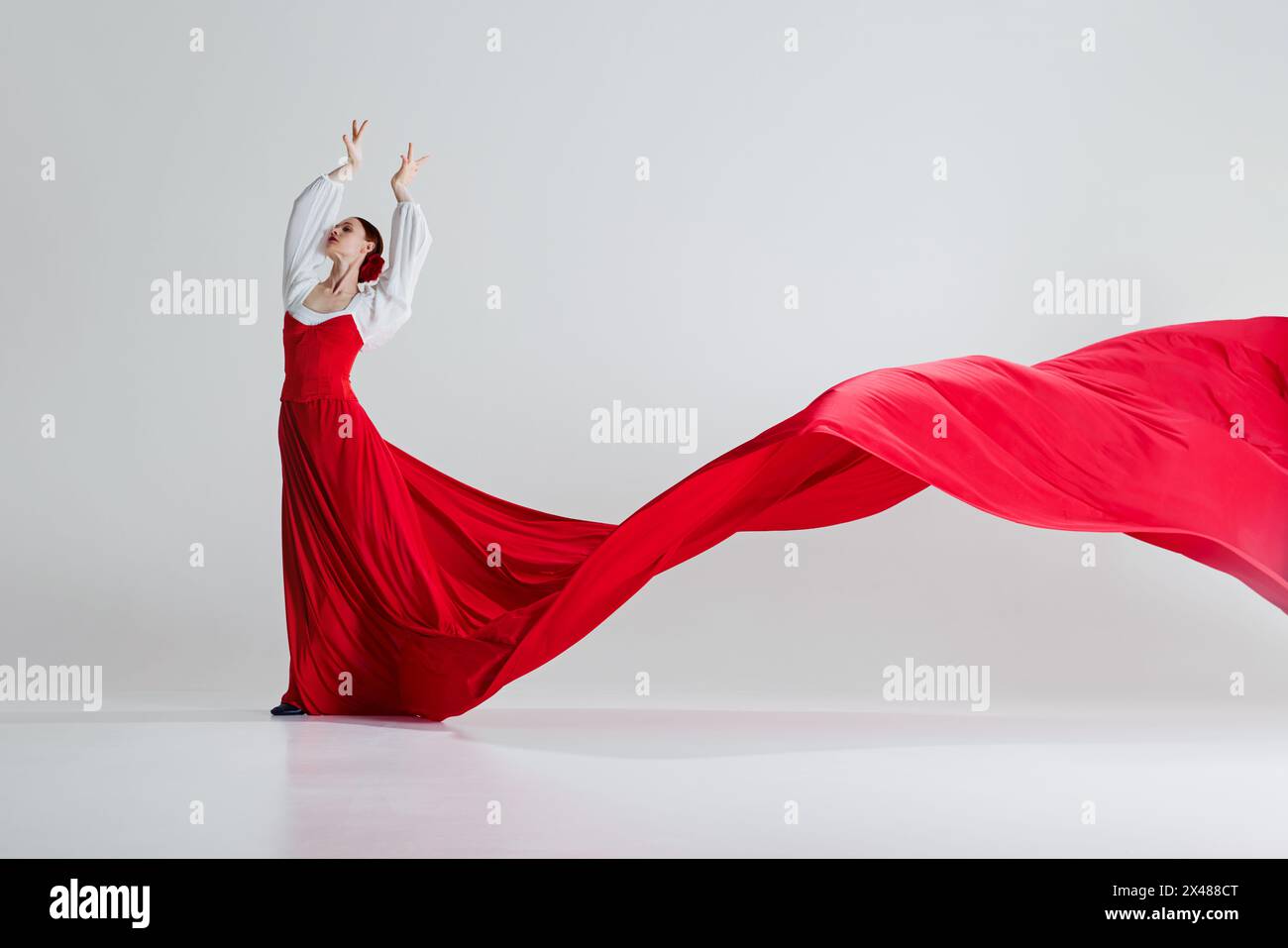 Vibrancy of flamenco dance is embodied in flowing red fabric, as female ...