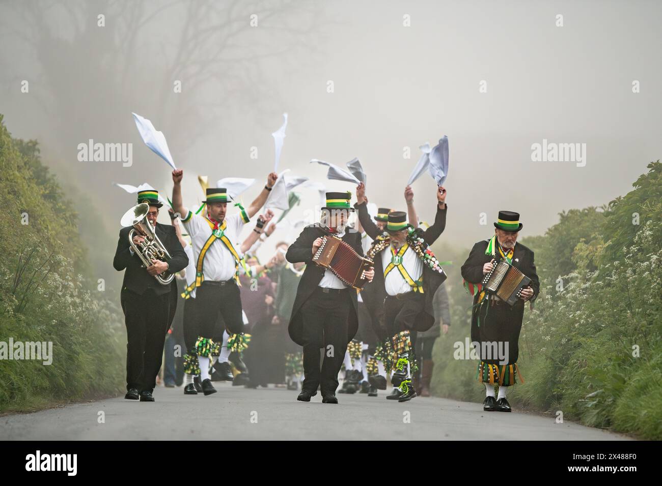 Long Man Morris Dancers perform below the Long Man of Wilmington, East ...