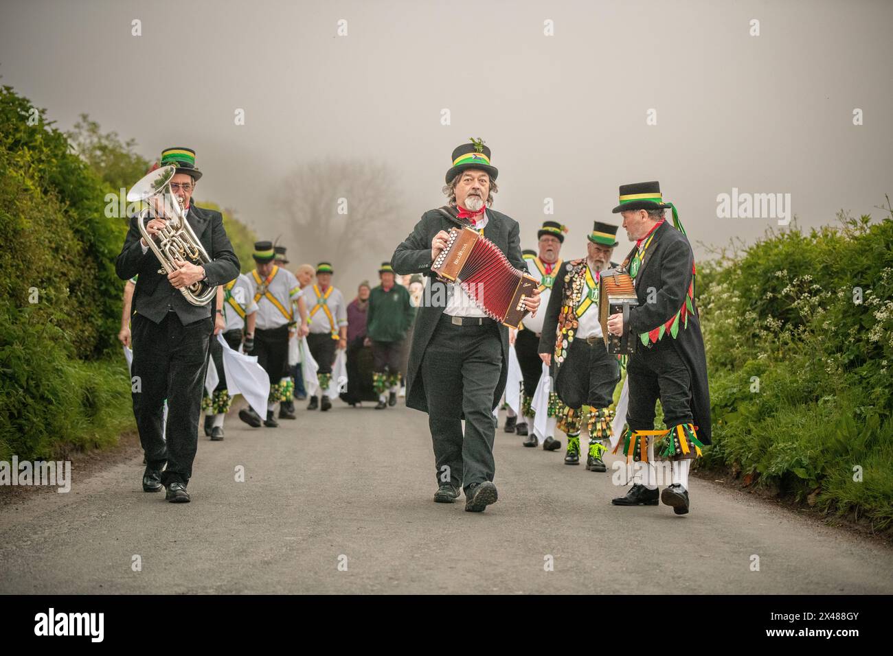 Long Man Morris Dancers perform below the Long Man of Wilmington, East ...