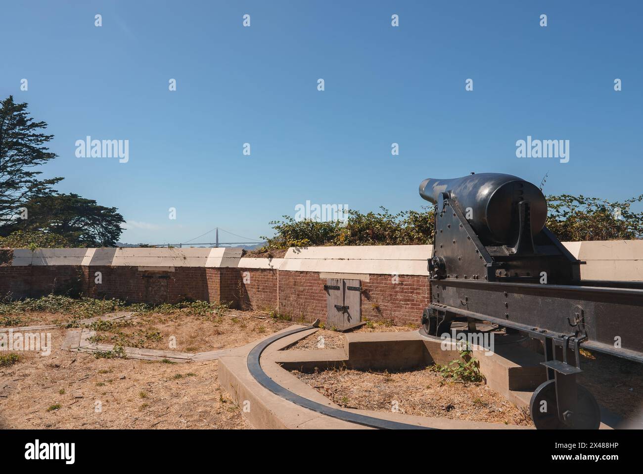 Vintage cannon aimed towards distant Golden Gate Bridge, San Francisco ...
