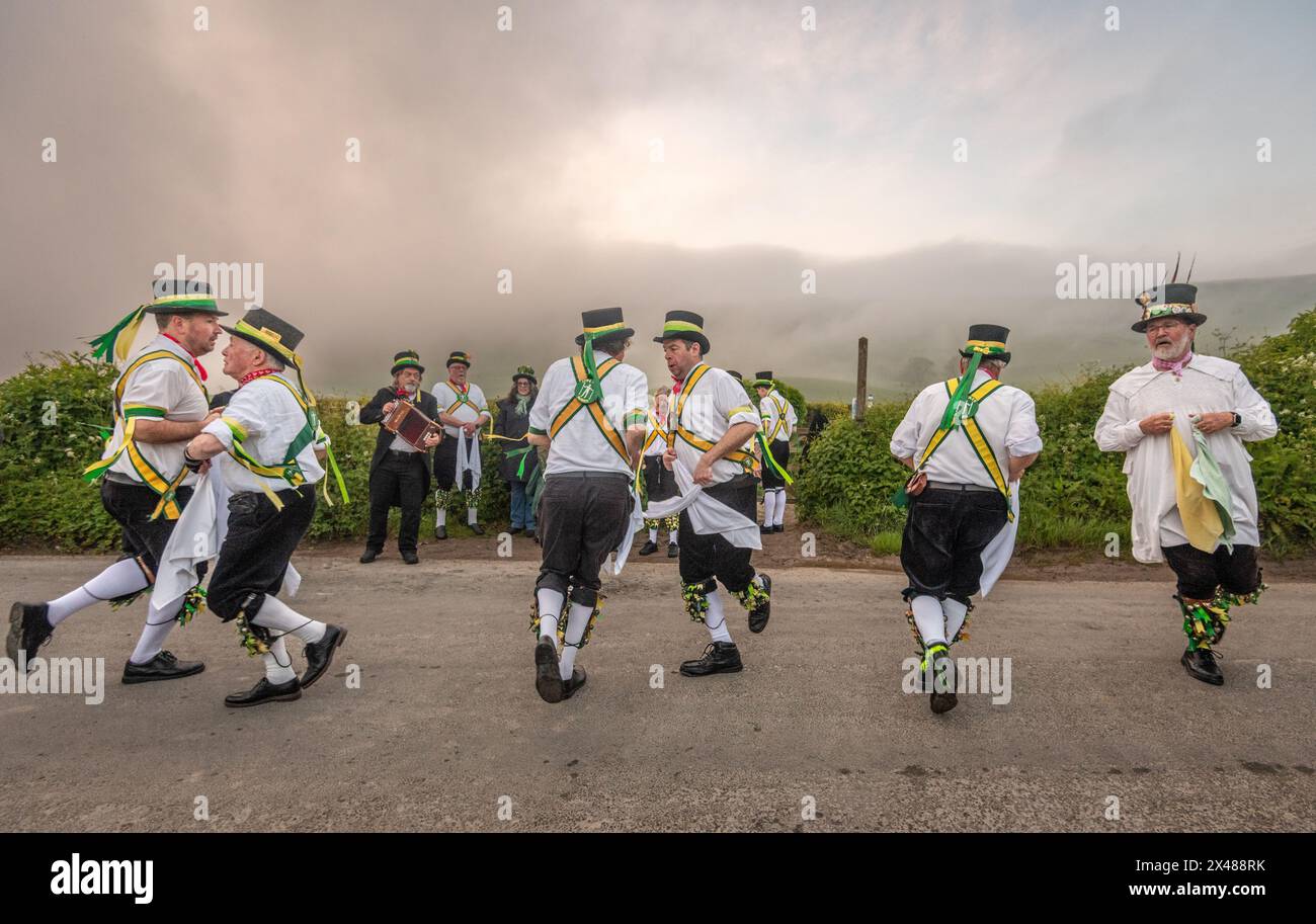 Long Man Morris Dancers perform below the Long Man of Wilmington, East ...