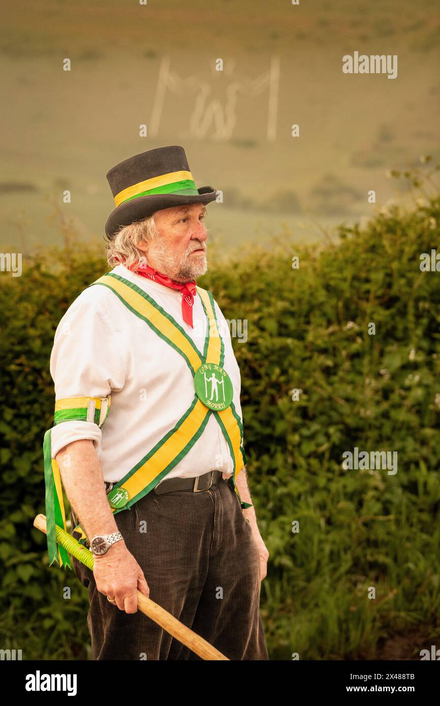 Long Man Morris Dancers perform below the Long Man of Wilmington, East ...