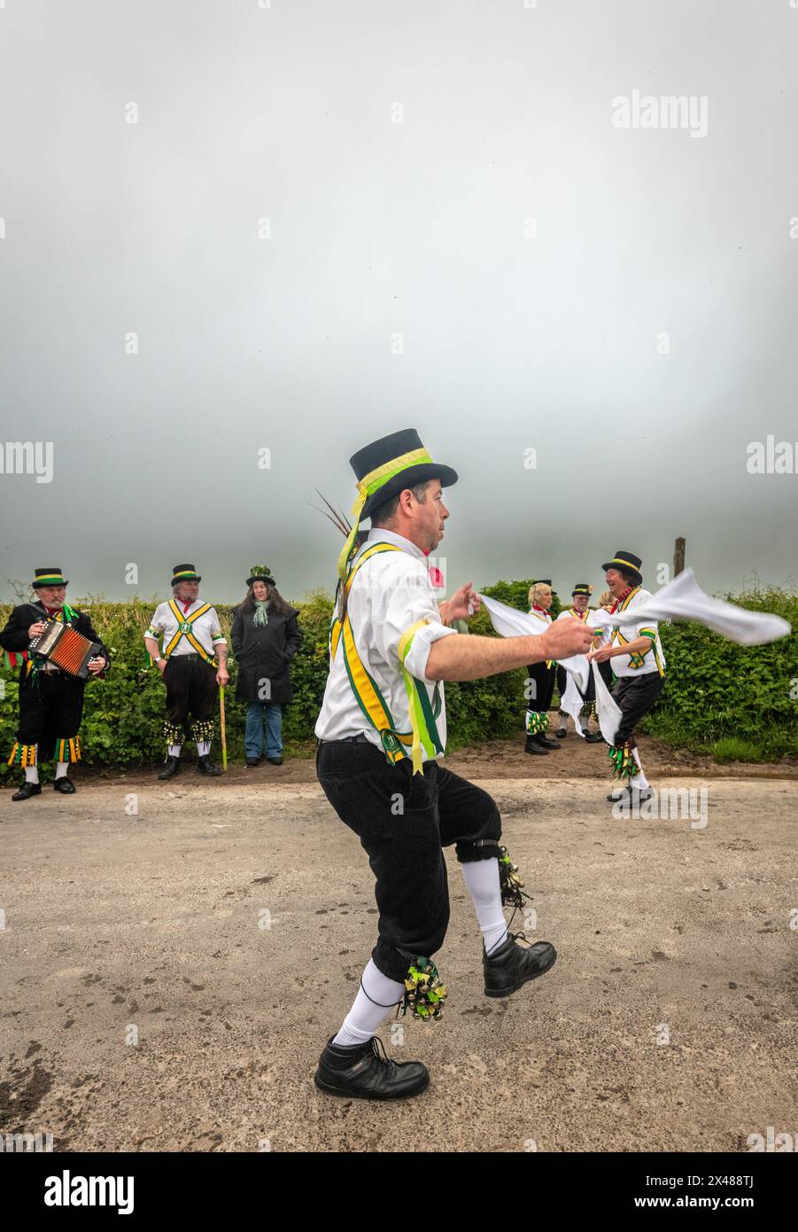 Long Man Morris Dancers perform below the Long Man of Wilmington, East ...